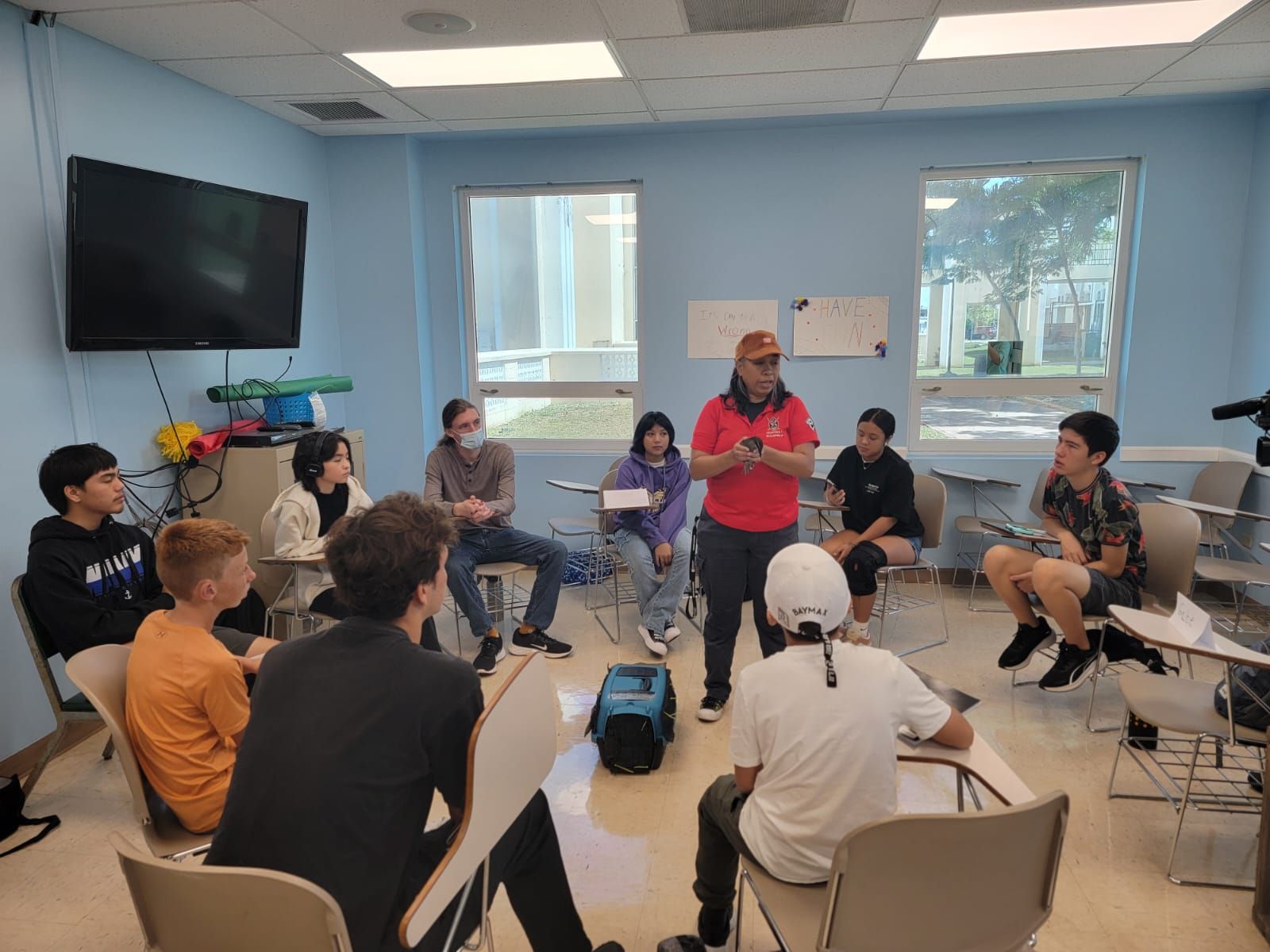 High schoolers meet koko bird and snake detector dog at UOG summer camp ...